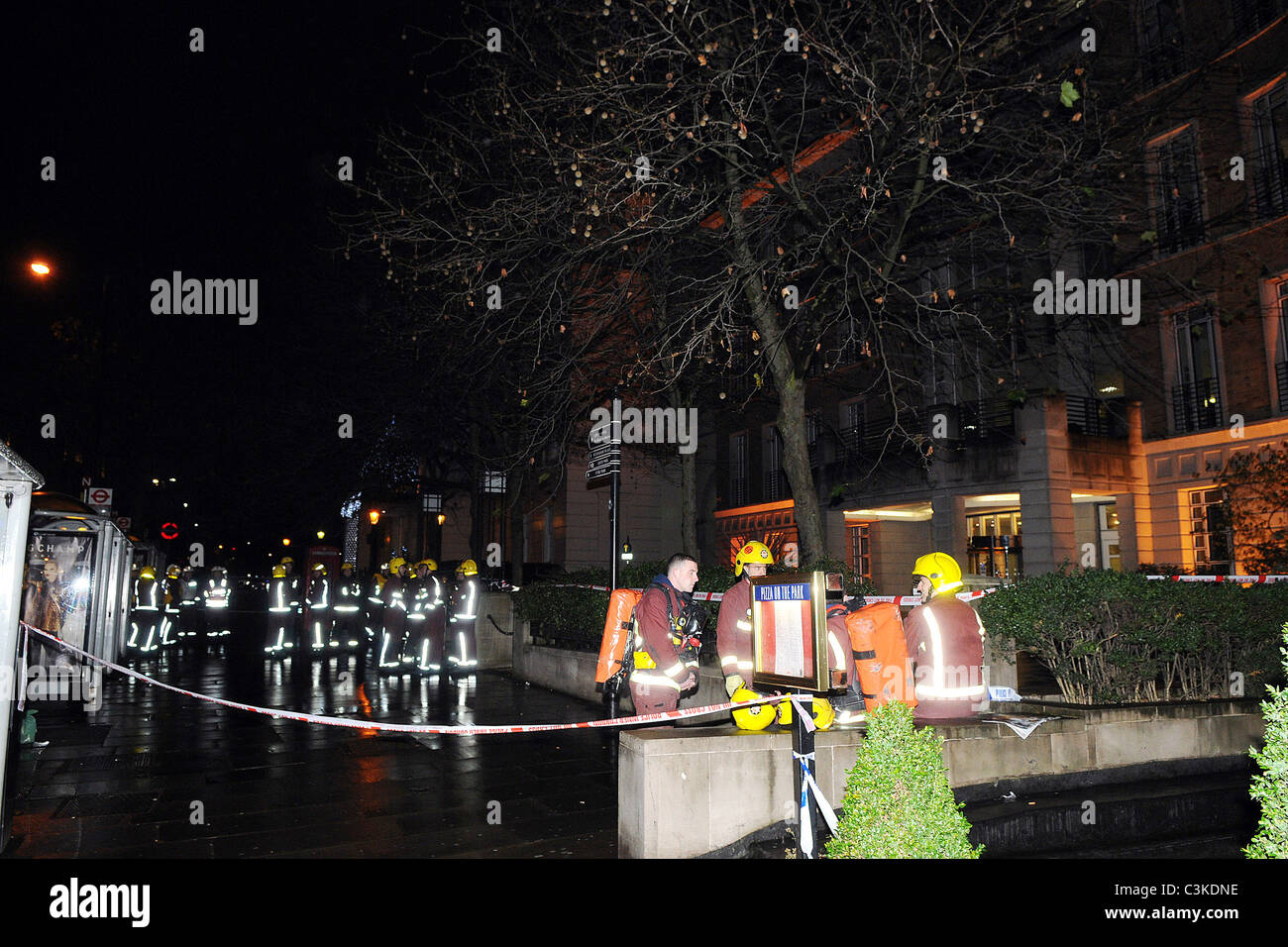 Fire crews and emergency services cordon off a building next to the ...