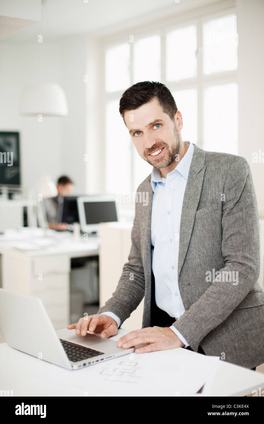 Man working in office Stock Photo - Alamy