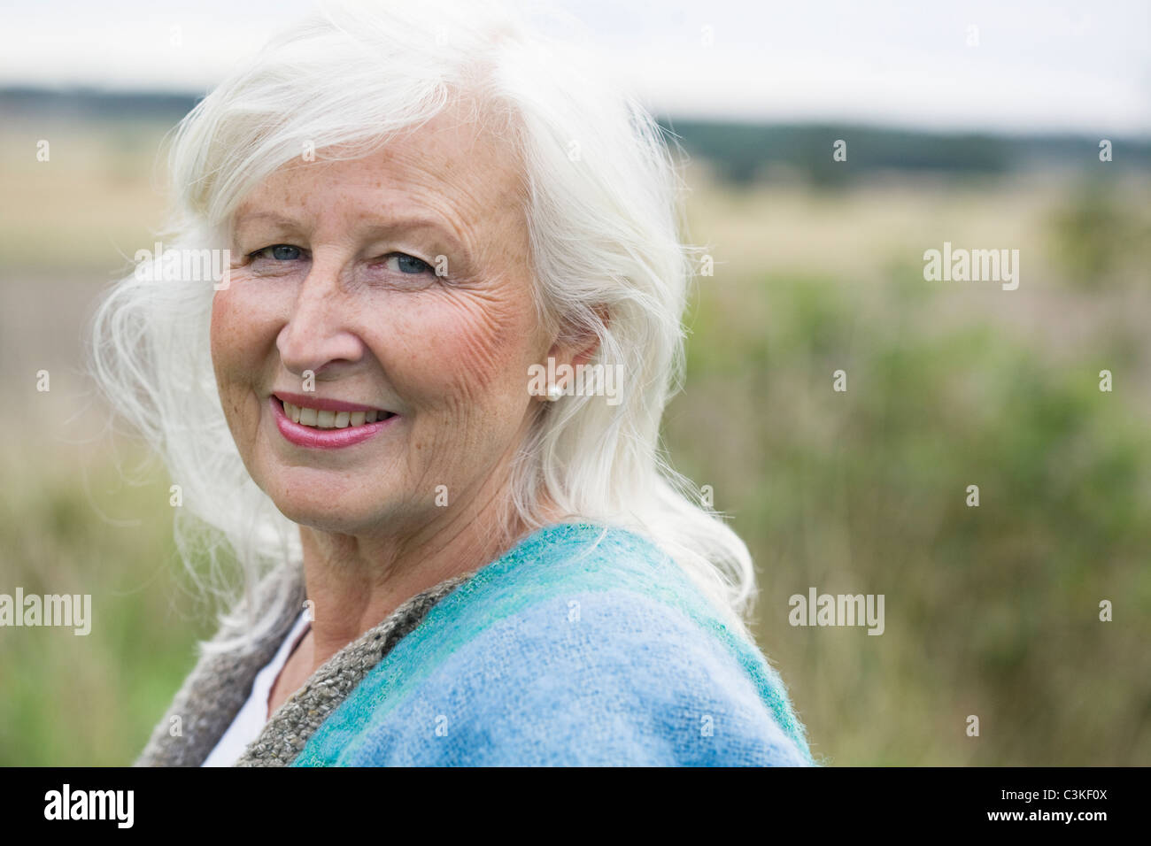 Portrait of senior woman smiling Stock Photo - Alamy