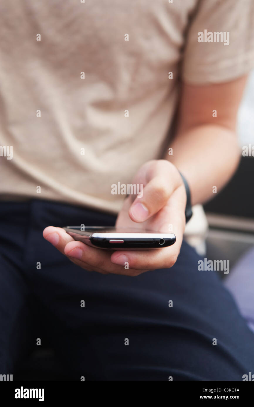 Man holding mobile phone Stock Photo - Alamy