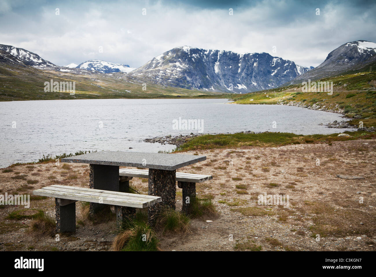 Picnic table over lake Stock Photo - Alamy