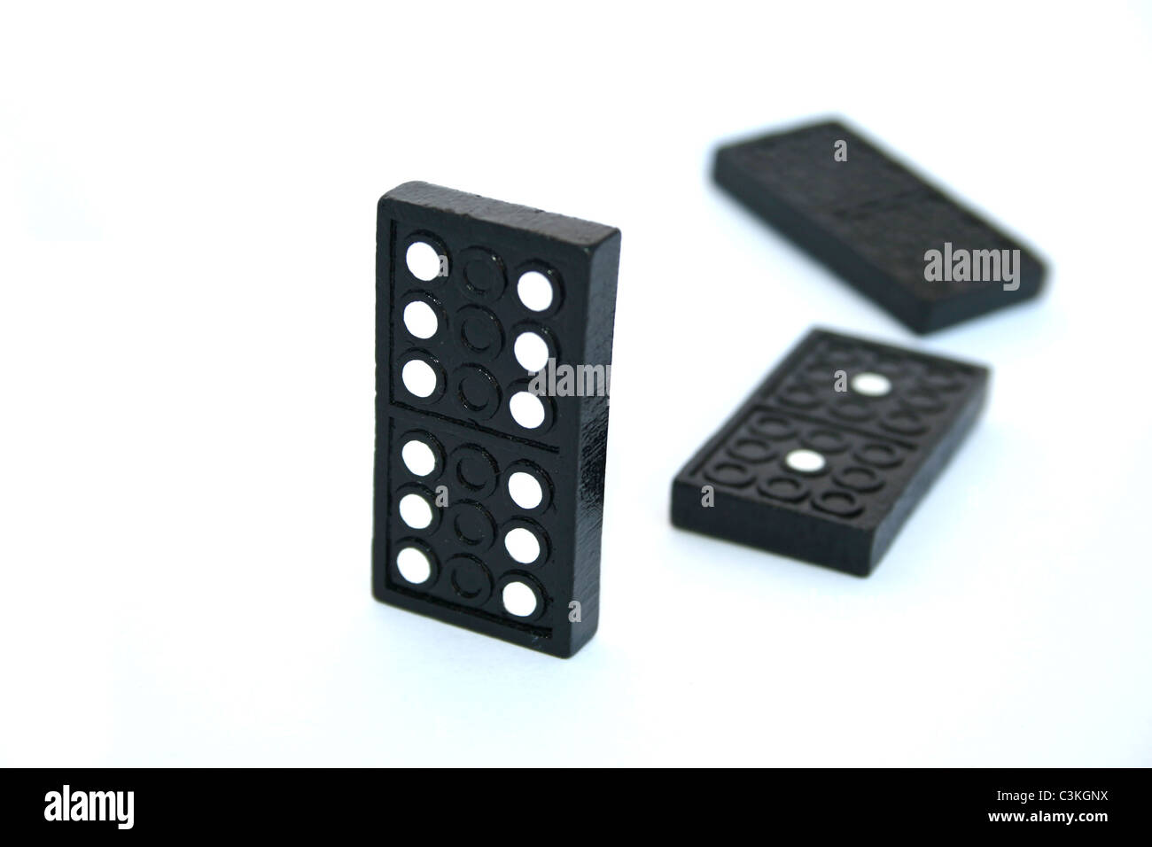 Weak dominoes and winner domino isolated on the white Stock Photo - Alamy