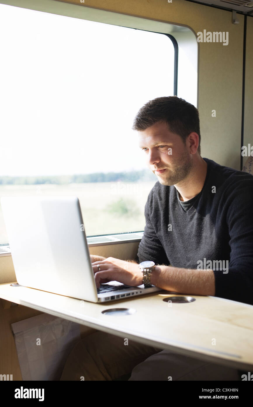 Man sitting on traffic light hi-res stock photography and images - Alamy