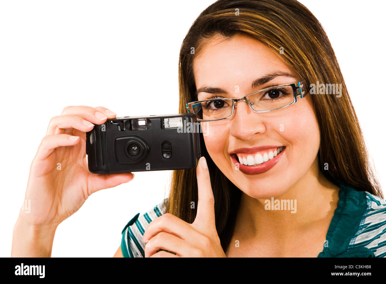 Fashion model photographing with a camera and smiling isolated over ...