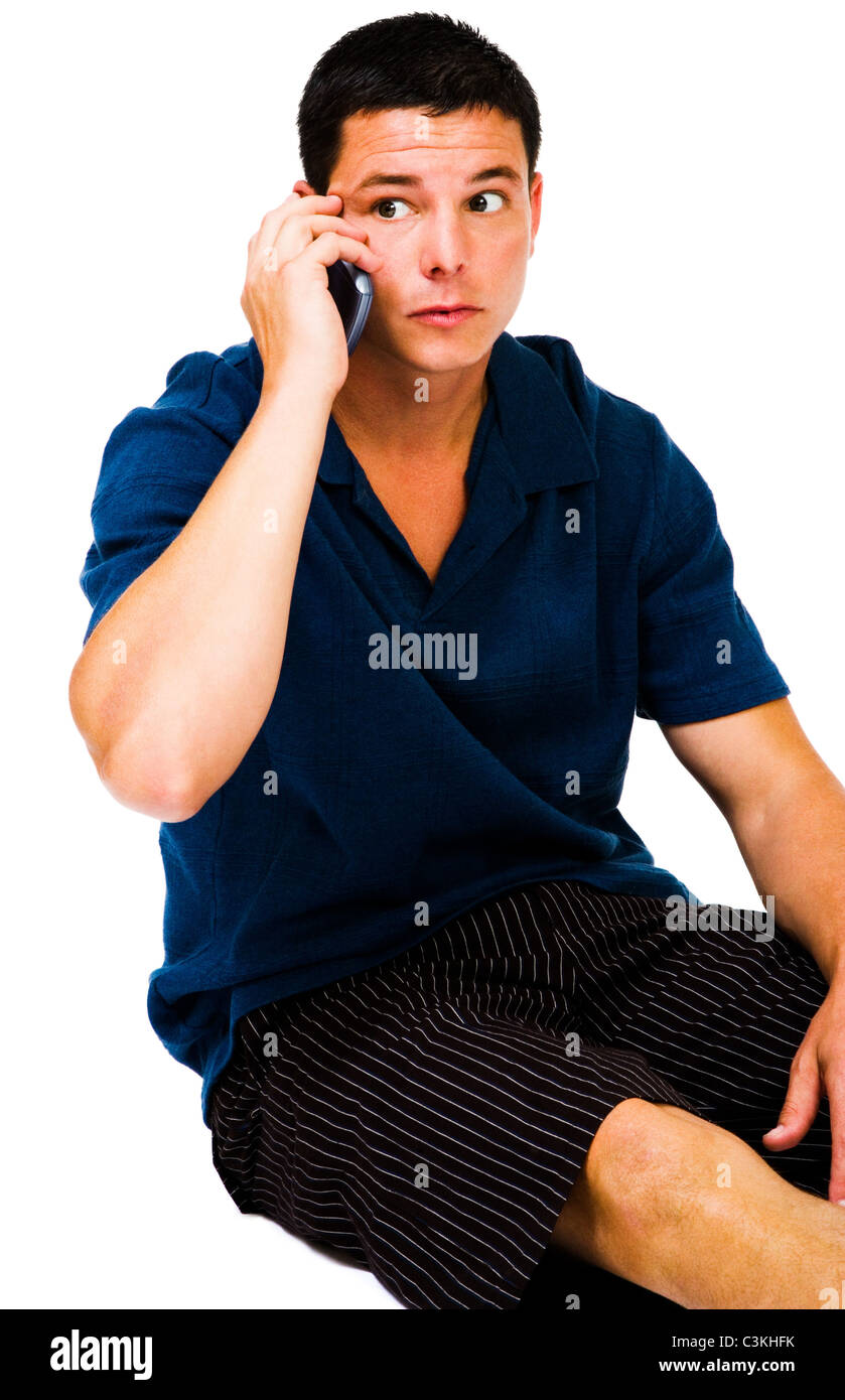 Fashion model talking on a mobile phone isolated over white Stock Photo ...