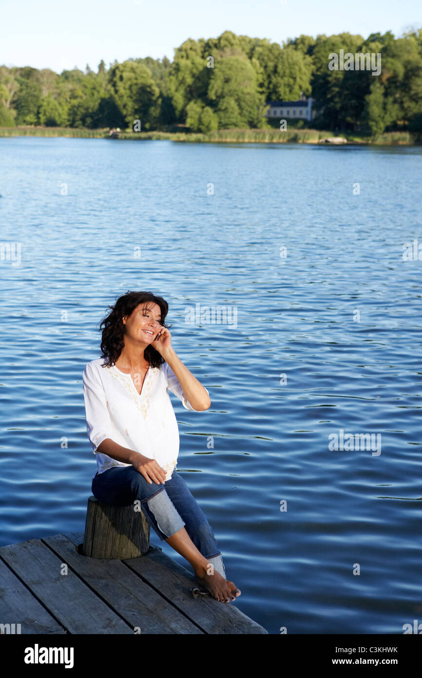 A woman using a mobile phone, Sweden Stock Photo - Alamy