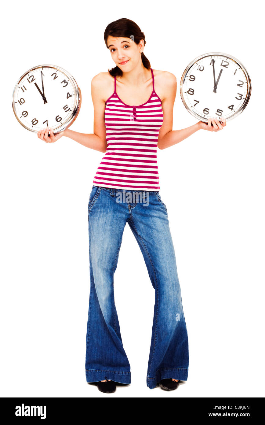 Young woman holding clocks and posing isolated over white Stock Photo ...