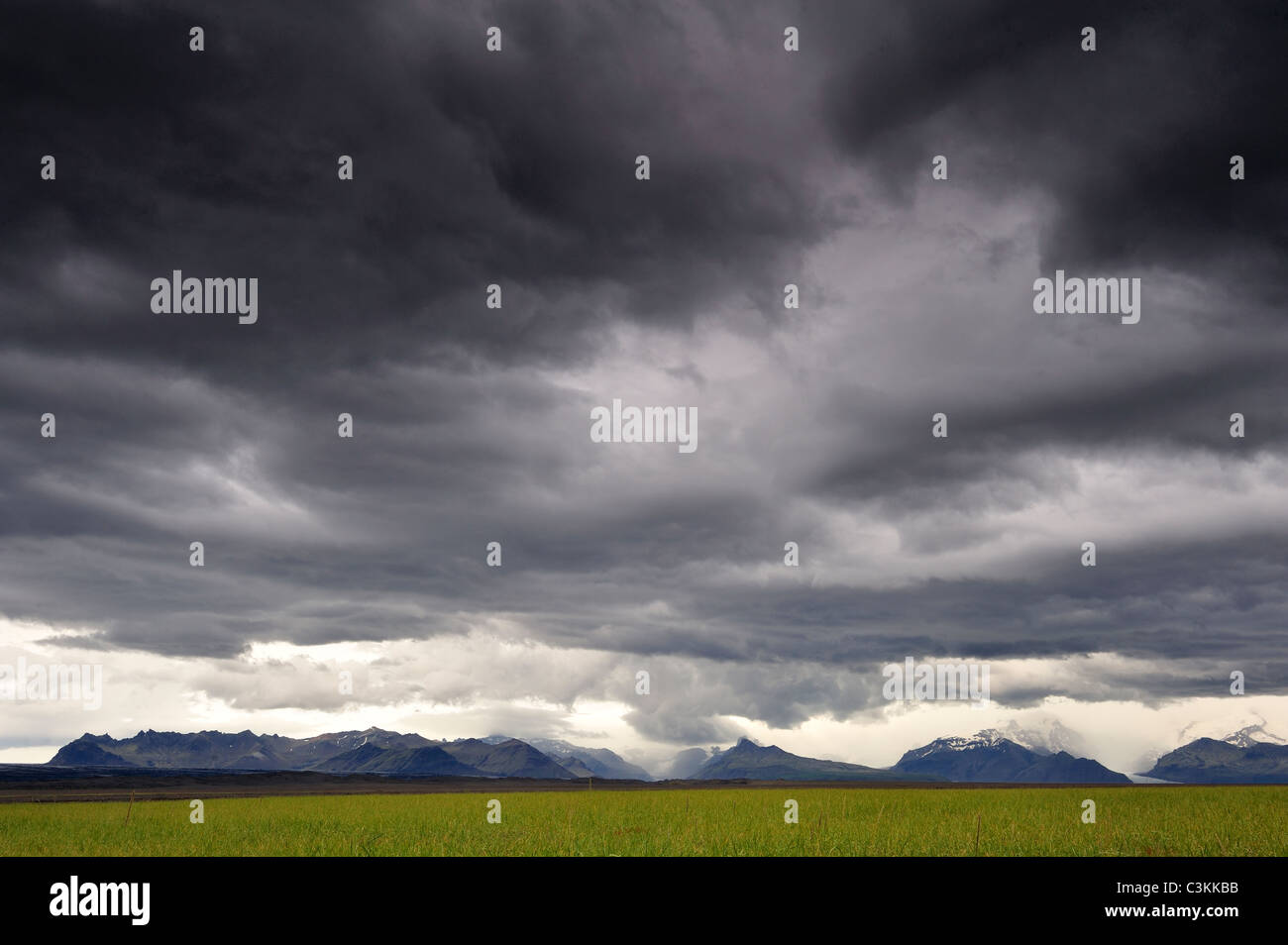 Storm clouds over mountain range Stock Photo - Alamy