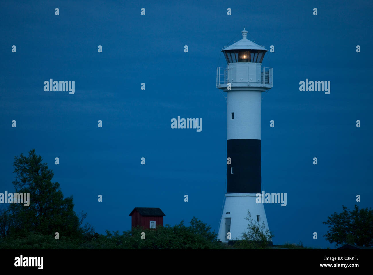 Lighthouse at dusk Stock Photo - Alamy