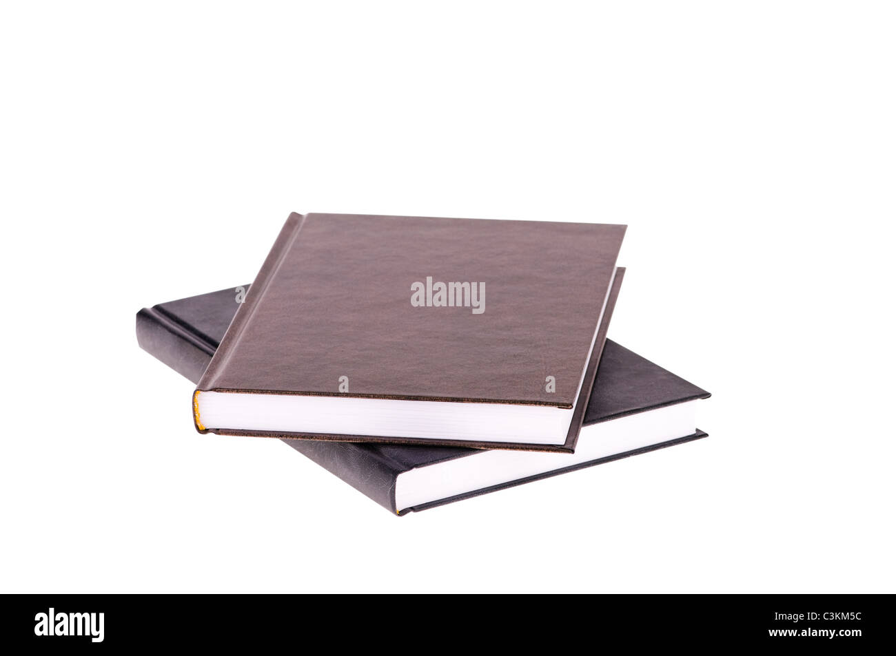 two brown books isolated on white background Stock Photo - Alamy