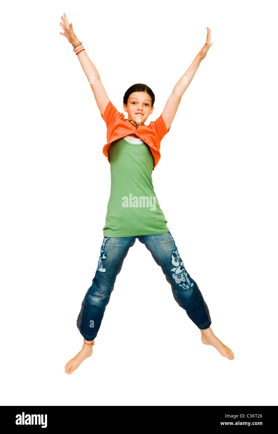 Smiling girl jumping and posing isolated over white Stock Photo - Alamy