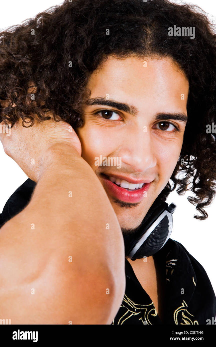 Fashion model wearing headphones and listening to music isolated over ...