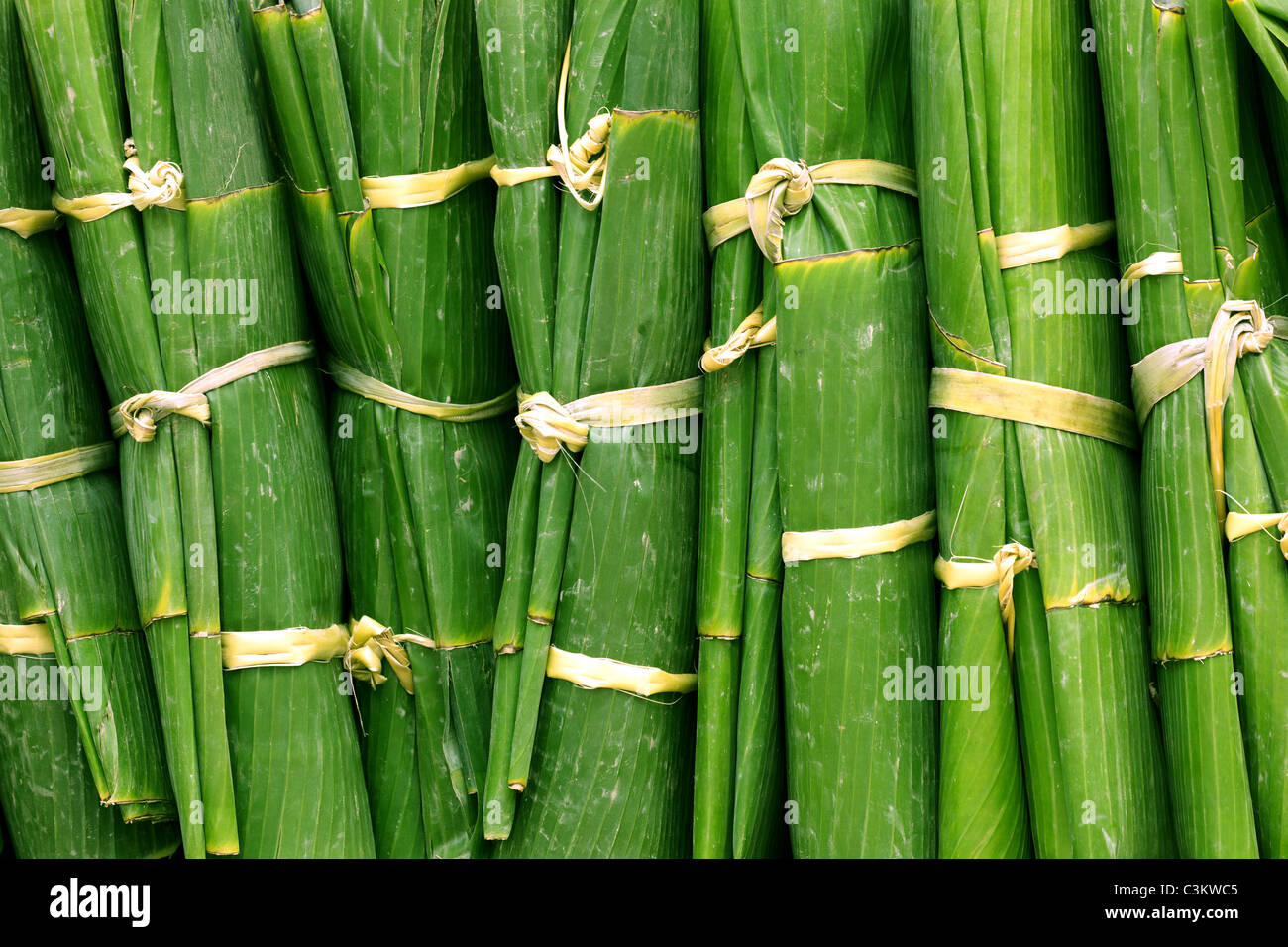 background of wrapped banana leaves in asian market Stock Photo - Alamy