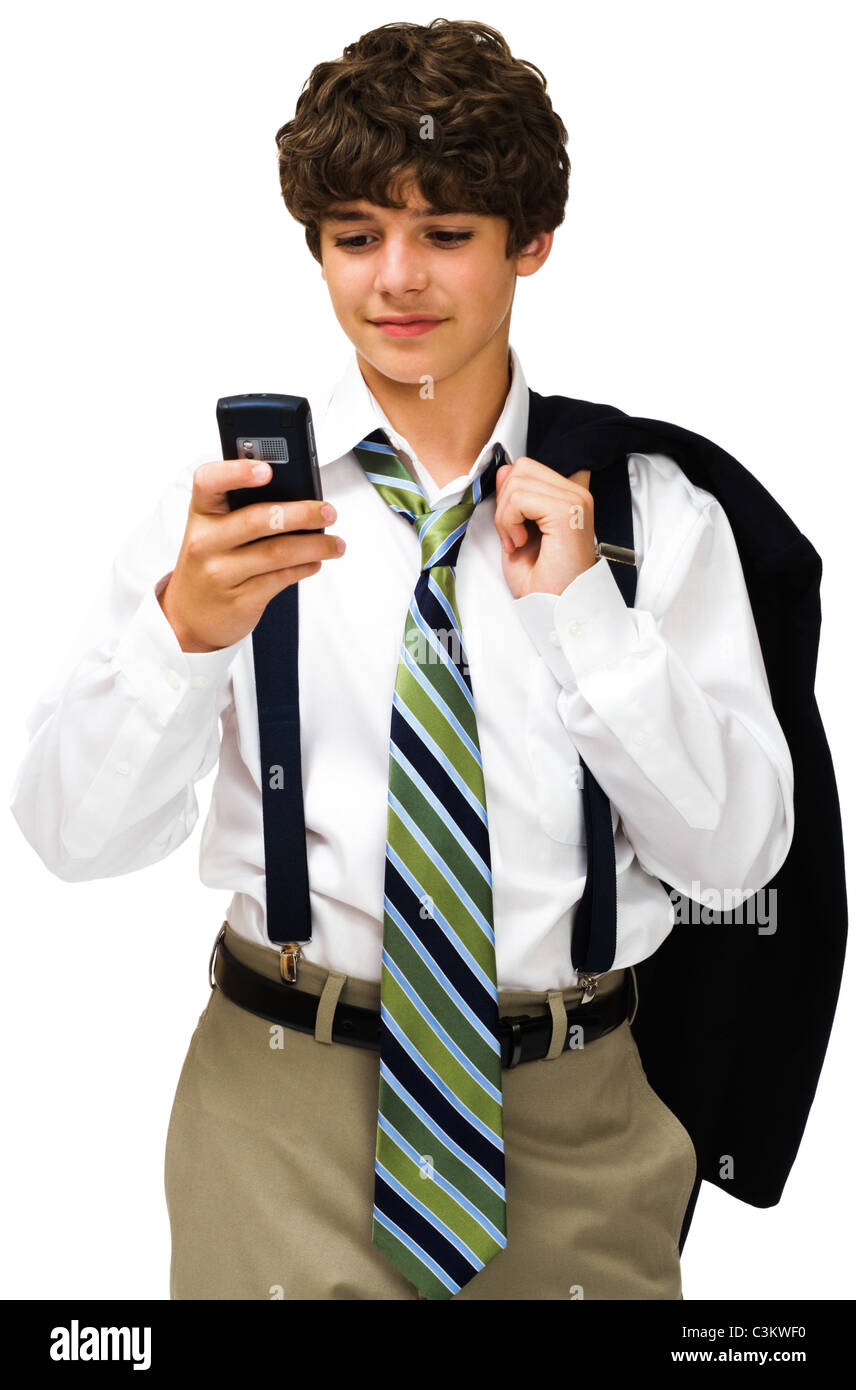 Smiling boy text messaging on a mobile phone isolated over white Stock ...