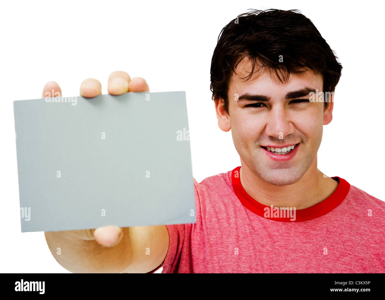 Portrait of a man showing a placard and smiling isolated over white ...