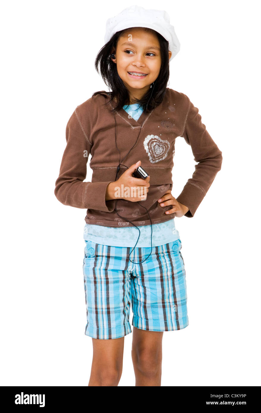 Girl listening to MP3 player isolated over white Stock Photo - Alamy