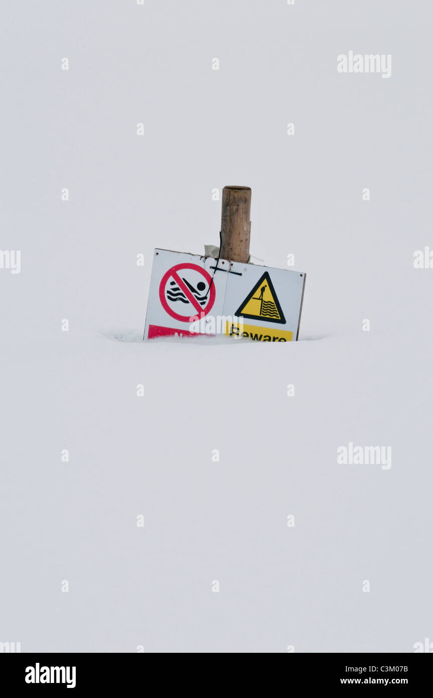 Danger Thin Ice signs over frozen water Stock Photo - Alamy