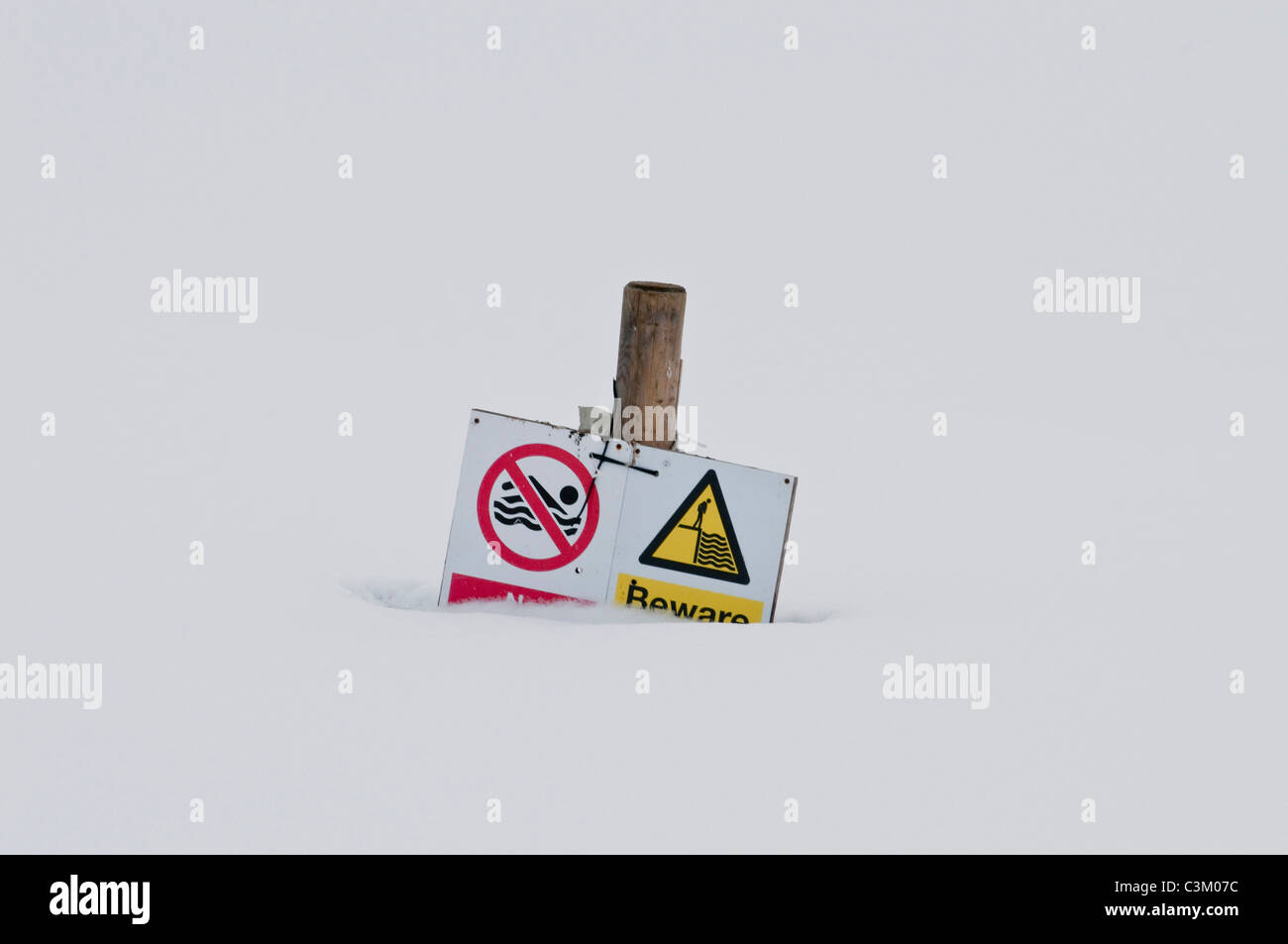 Danger Thin Ice signs over frozen water Stock Photo - Alamy