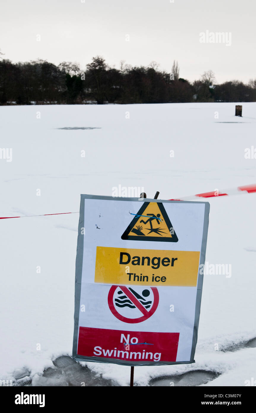Danger Thin Ice signs over frozen water Stock Photo - Alamy