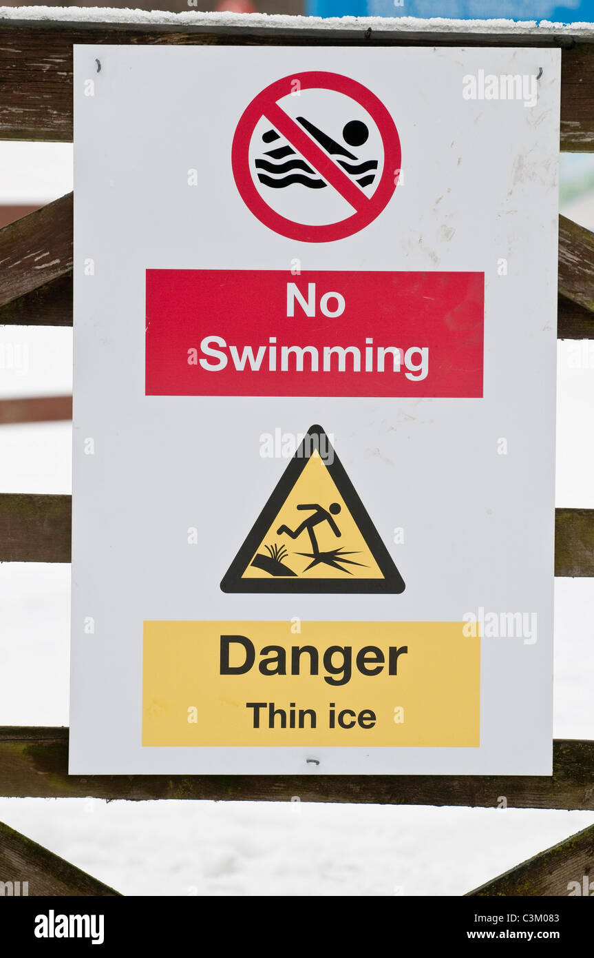 Danger Thin Ice signs over frozen water Stock Photo - Alamy