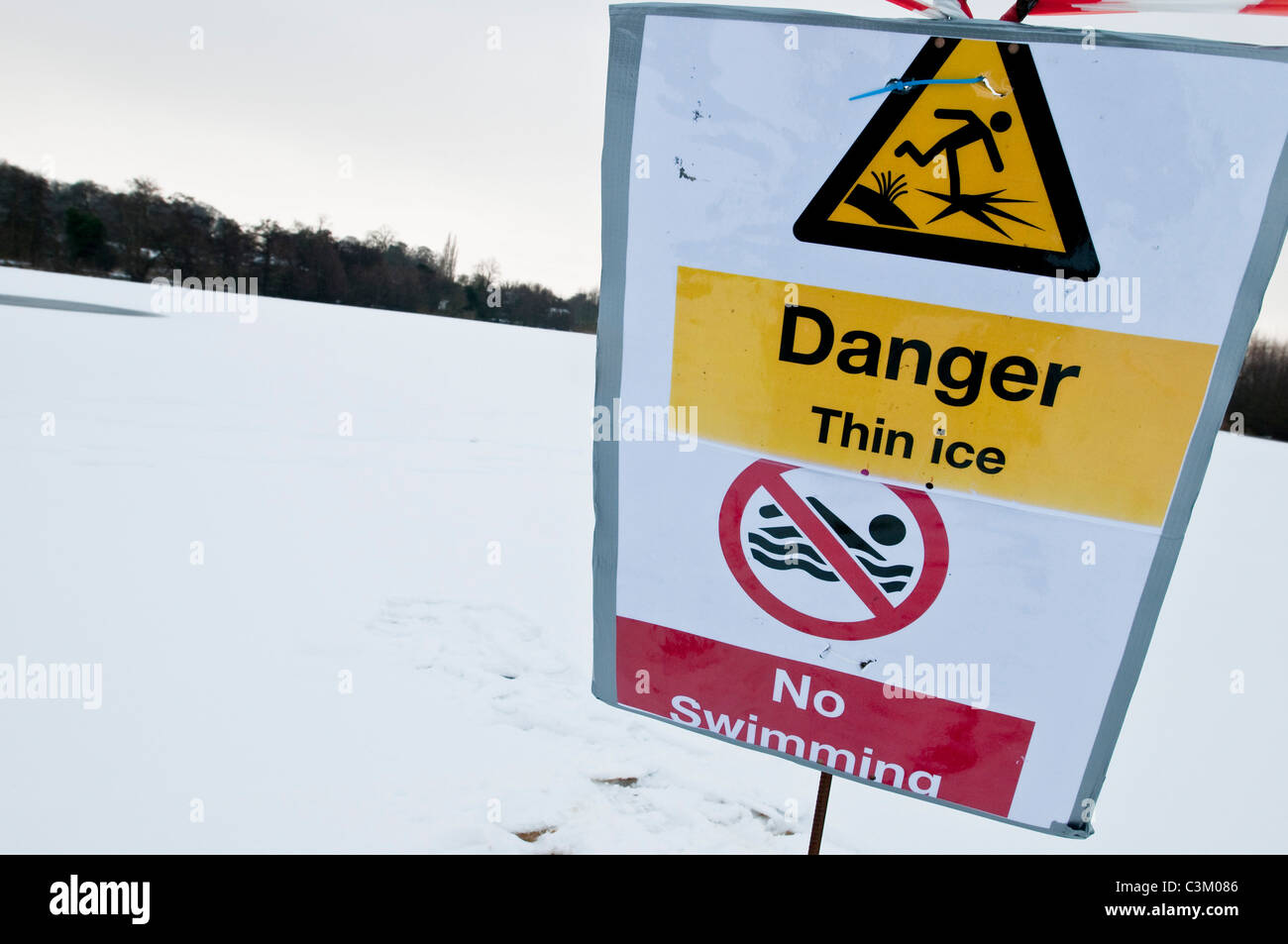 Danger Thin Ice signs over frozen water Stock Photo - Alamy
