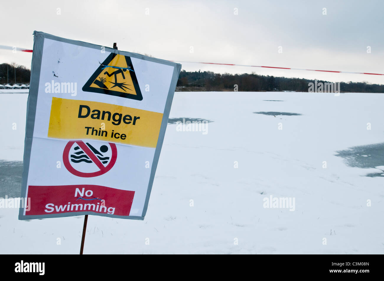 Danger Thin Ice signs over frozen water Stock Photo - Alamy
