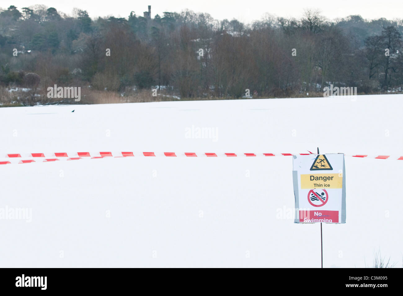 Danger Thin Ice signs over frozen water Stock Photo - Alamy