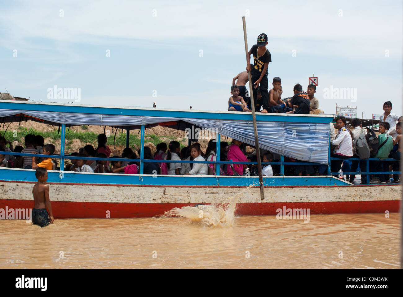 Packed boat with children on Tonle Sap Lake near Siem Reap Cambodia ...