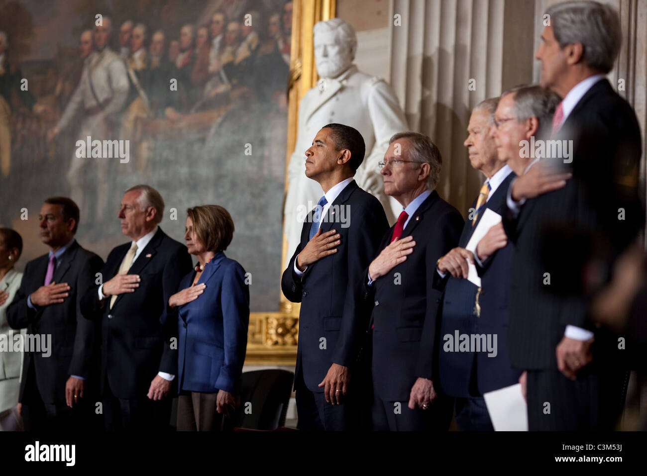 President Barack Obama and Members of Congress stand for the national ...