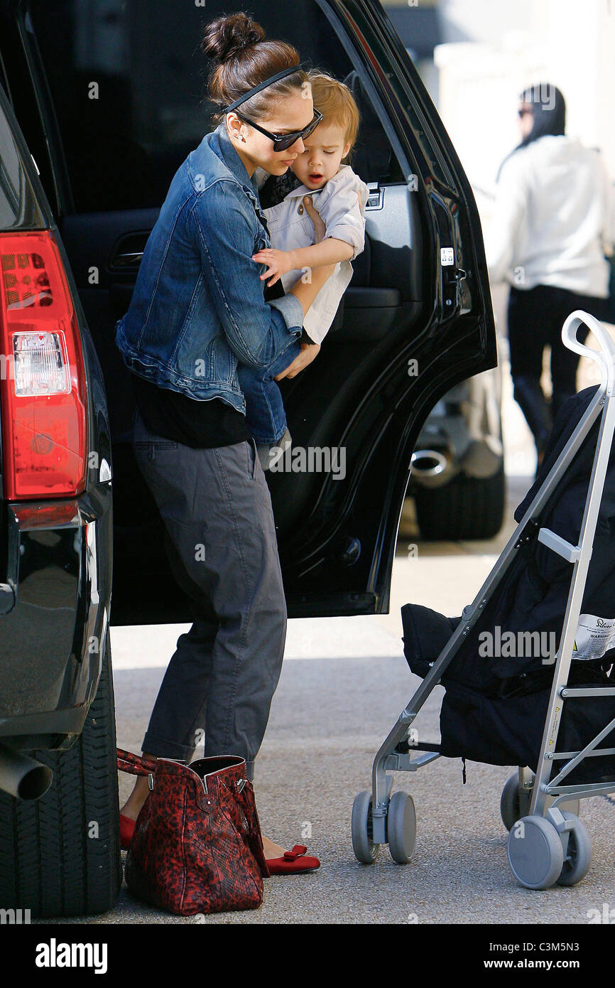Jessica Alba puts her daughter, Honor Marie, in her stroller as they go ...
