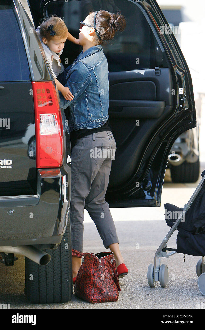Jessica Alba puts her daughter, Honor Marie, in her stroller as they go ...