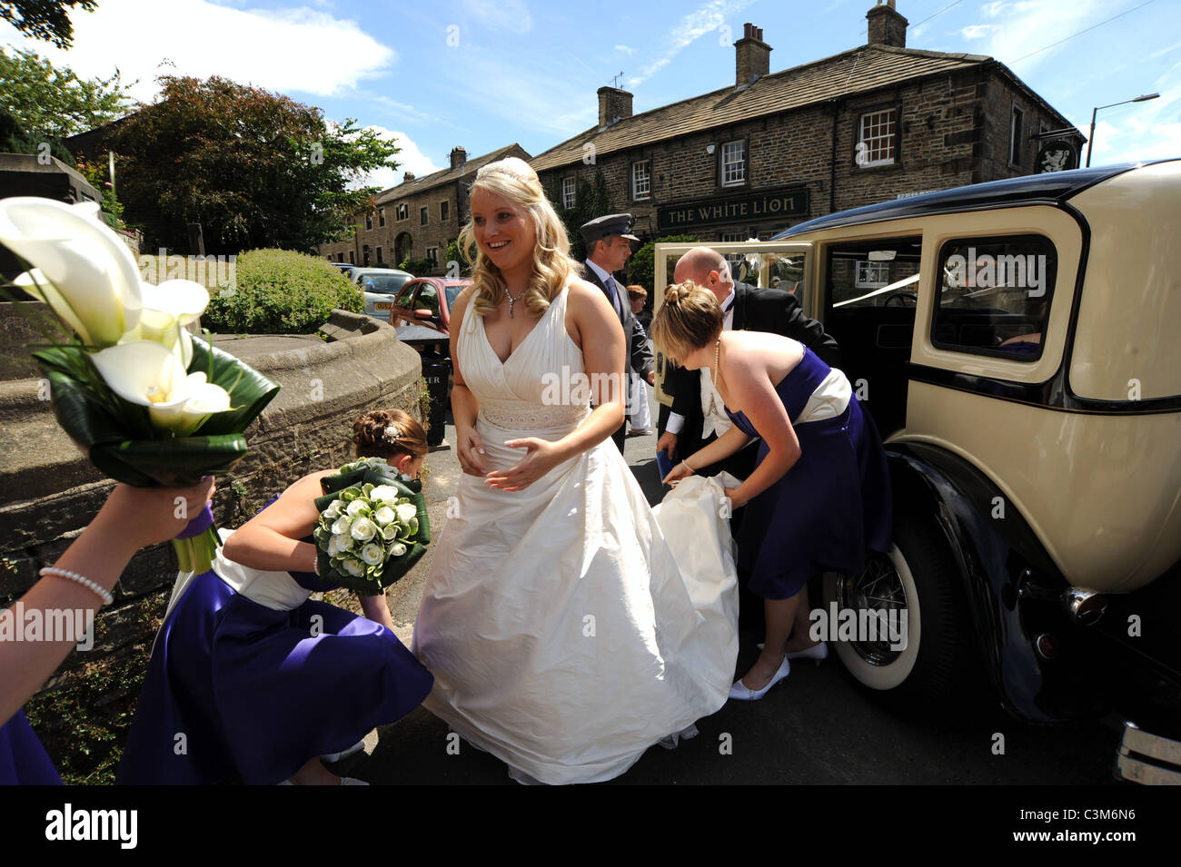 A bride arrives at the church to get married Stock Photo - Alamy
