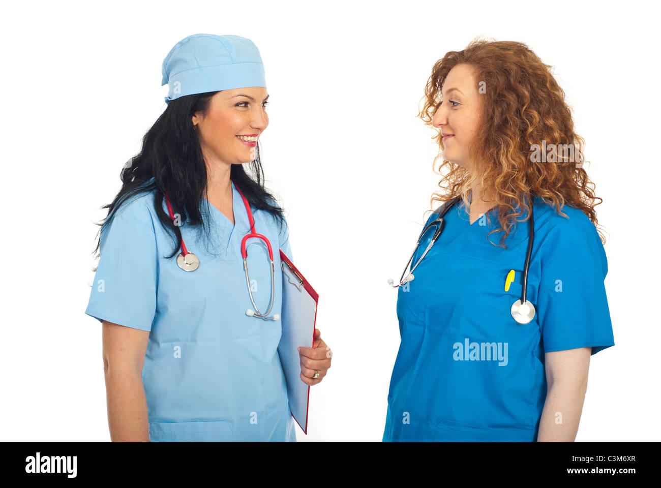 Two cheerful doctors women team having happy conversation isolated on ...