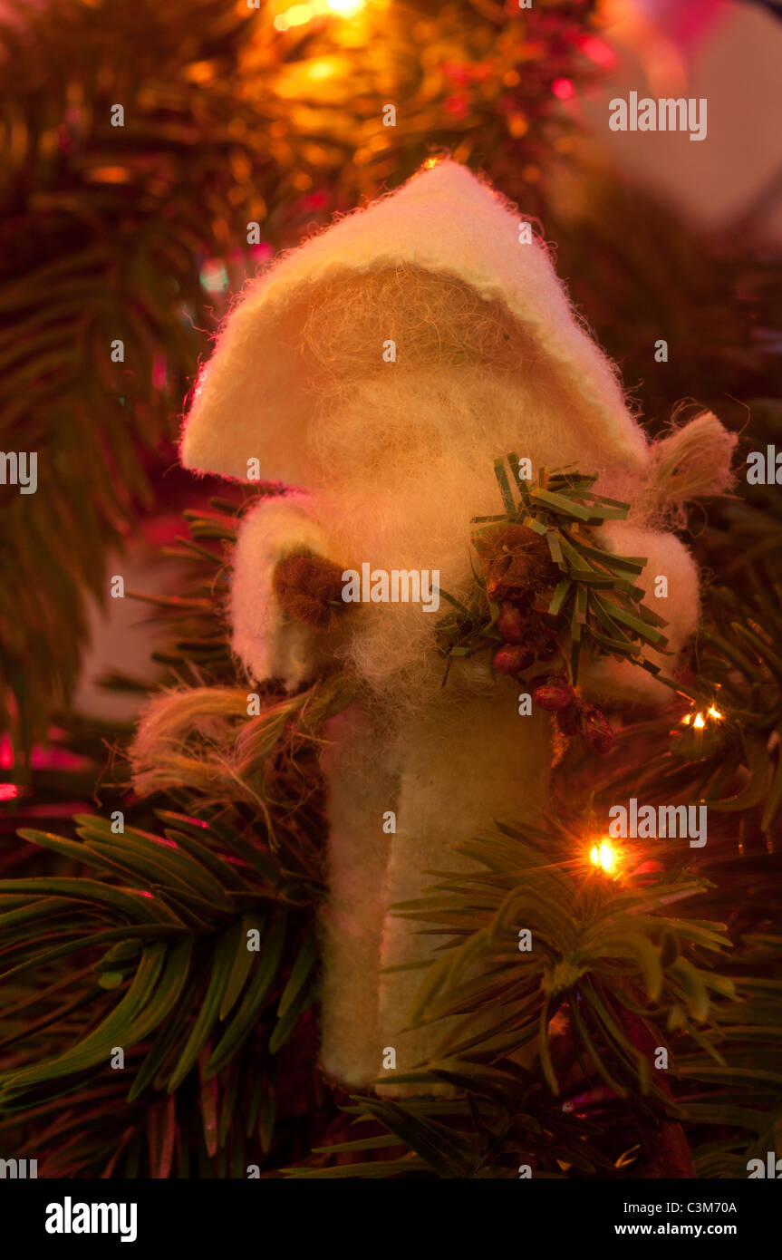 A handmade Santa ornament decorates a Christmas tree Stock Photo - Alamy