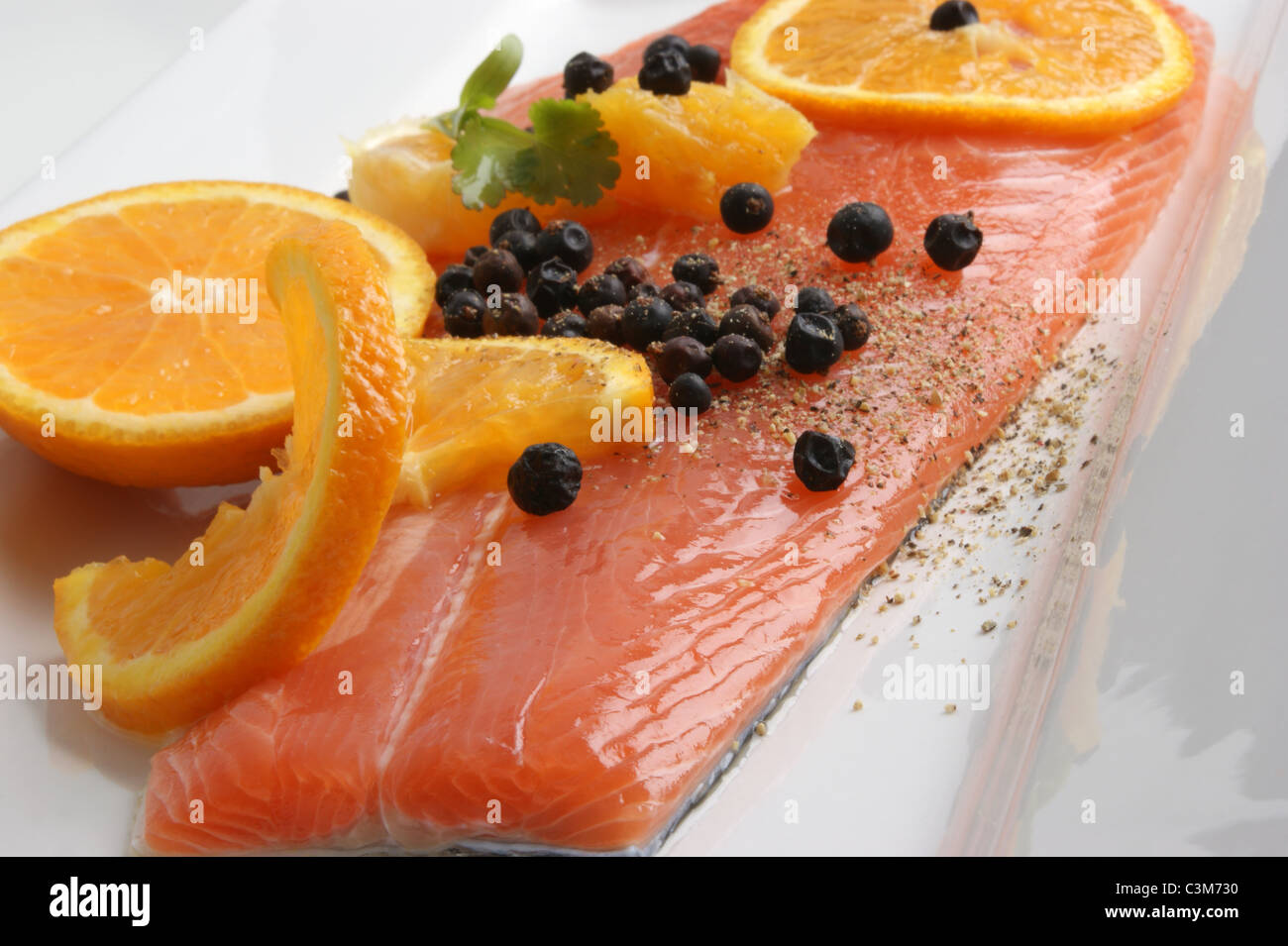 Salmon fillet on a white plate is prepared as food Stock Photo - Alamy