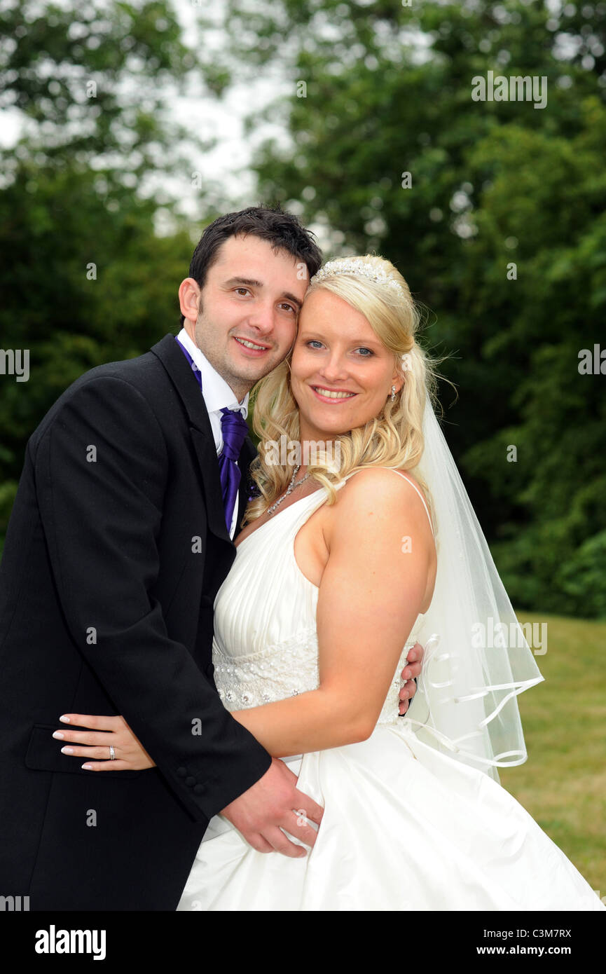 Portrait of Bride and groom at a traditional white wedding Stock Photo ...