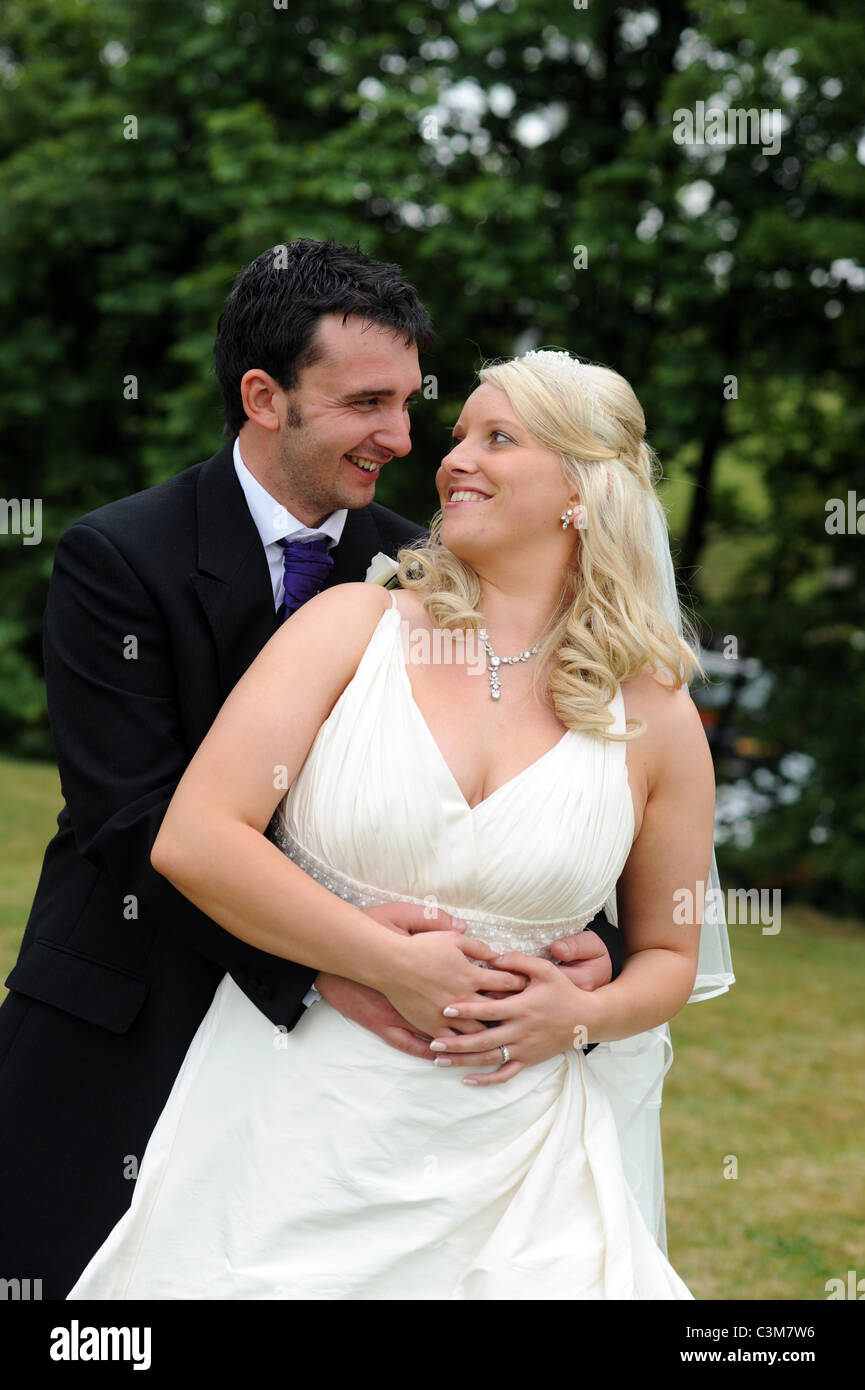 Portrait of Bride and groom at a traditional white wedding Stock Photo ...