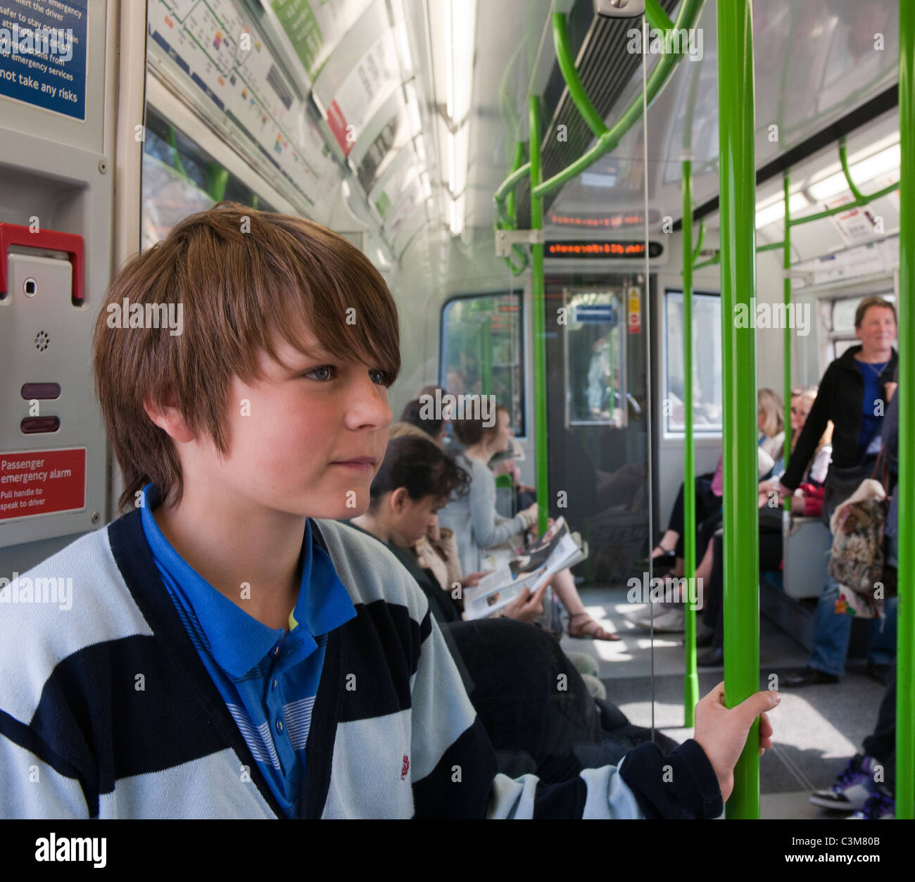 Young English boy rides on the London Underground train, London ...