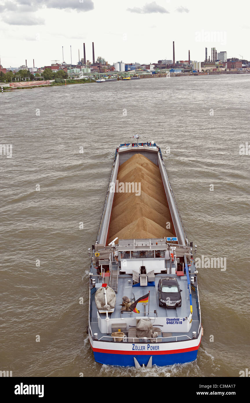 Barge transporting construction aggregate on the river Rhine ...