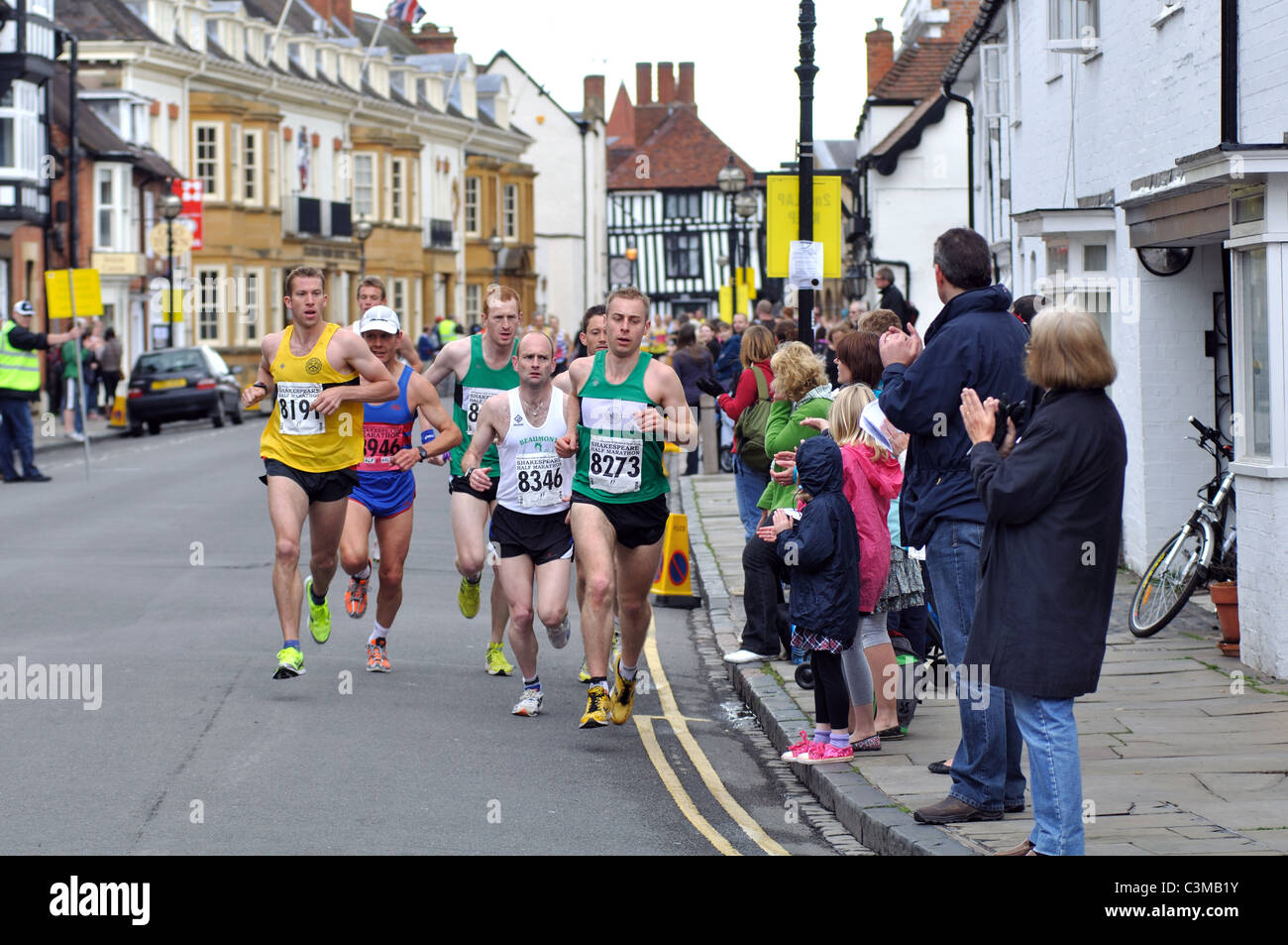 People clapping leading runners in the Shakespeare Marathon and Half ...