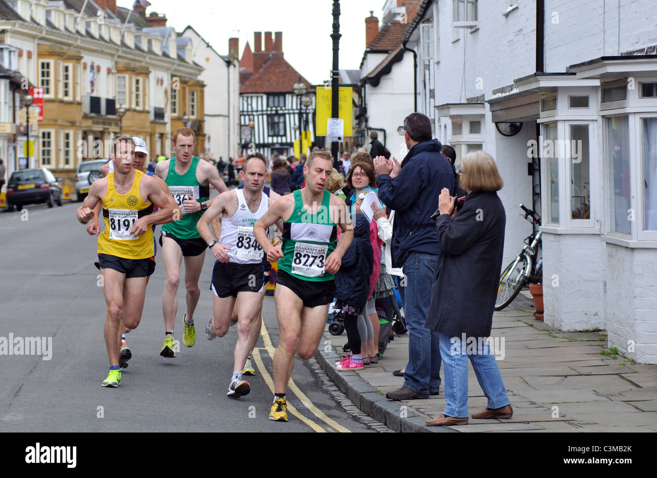 People clapping leading runners in the Shakespeare Marathon and Half ...