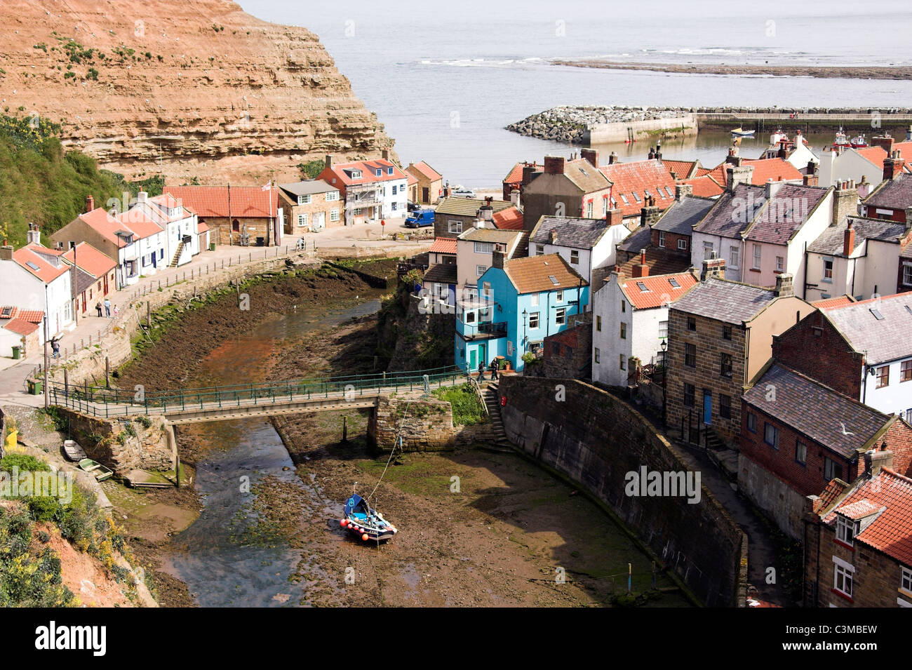 Staithes Beck, coble boat in the estuary of the small fishing village ...