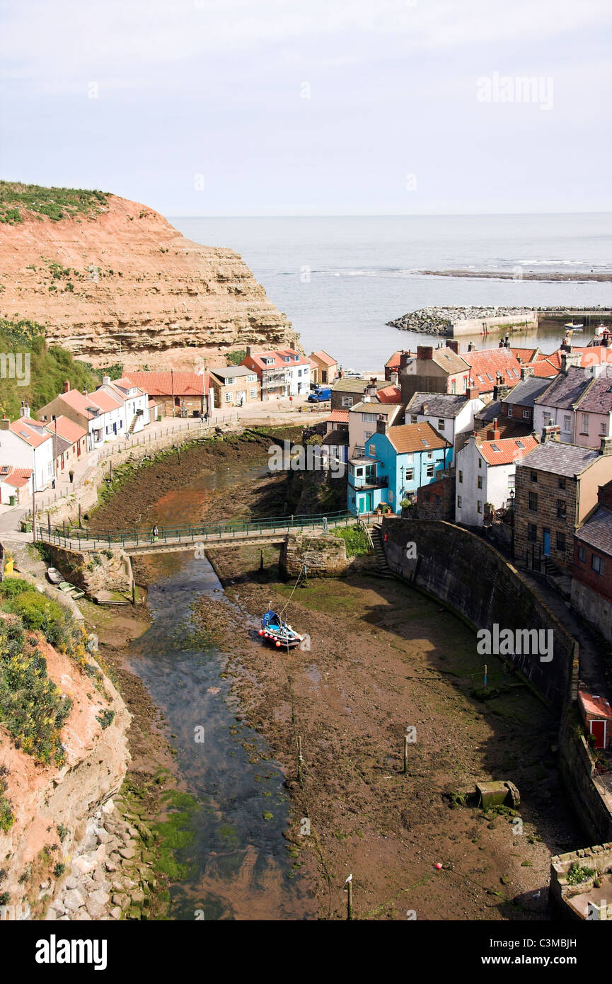Staithes Beck, coble boat in the estuary of the small fishing village ...