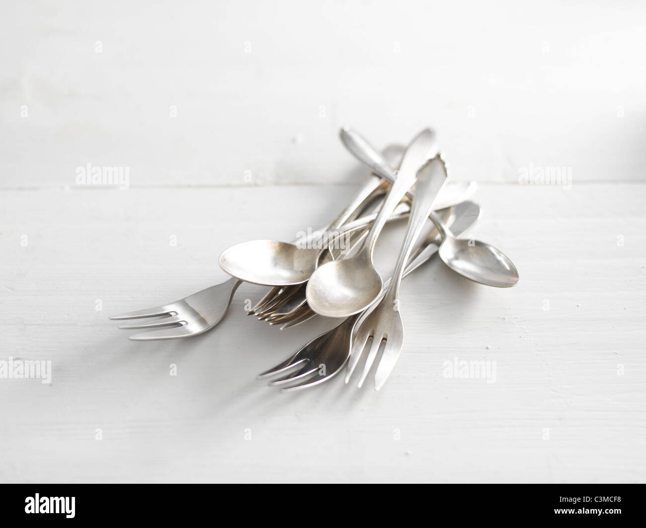 Spoons and forks, close-up Stock Photo - Alamy