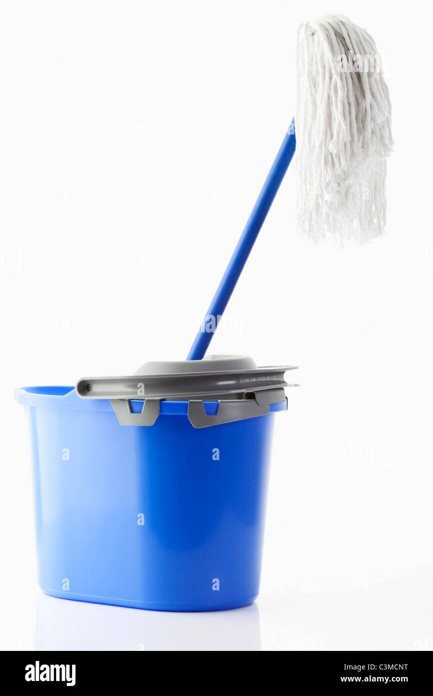 Blue bucket with mop on white background Stock Photo - Alamy