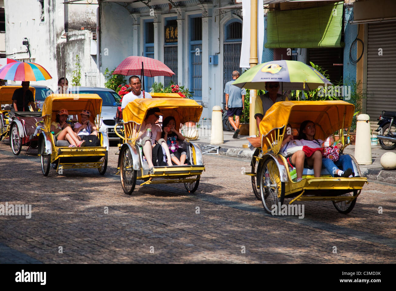 A Rickshaw Ride in the Streets of Georgetown, Penang Stock Photo - Alamy