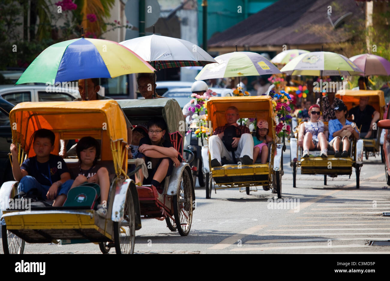 A Rickshaw Ride in the Streets of Georgetown, Penang Stock Photo - Alamy