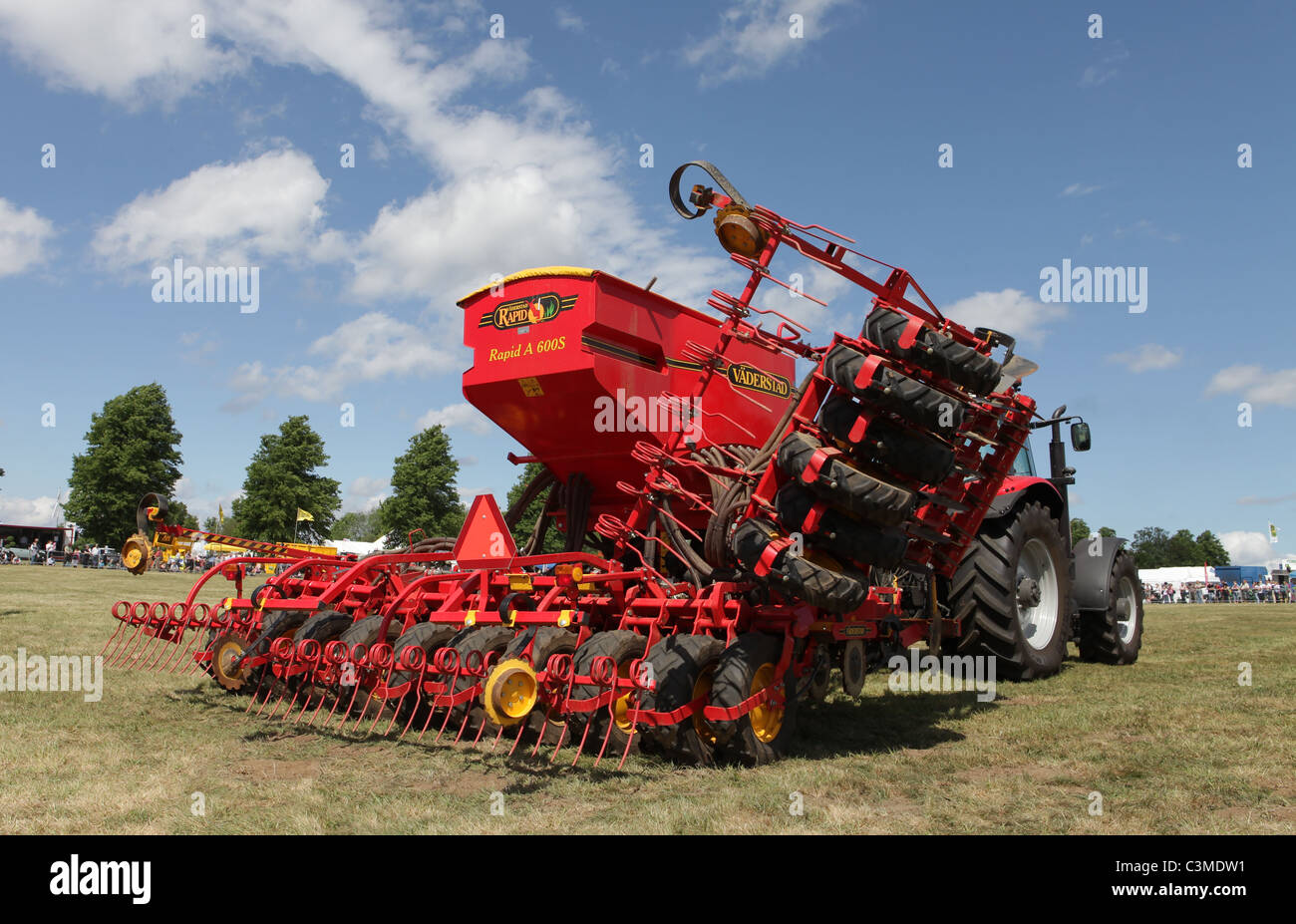 EDITORIAL USE image of a tractor and plough at the South Suffolk Show ...