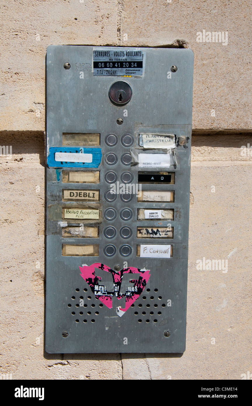 A door entry intercom system and names on a building in the City of ...