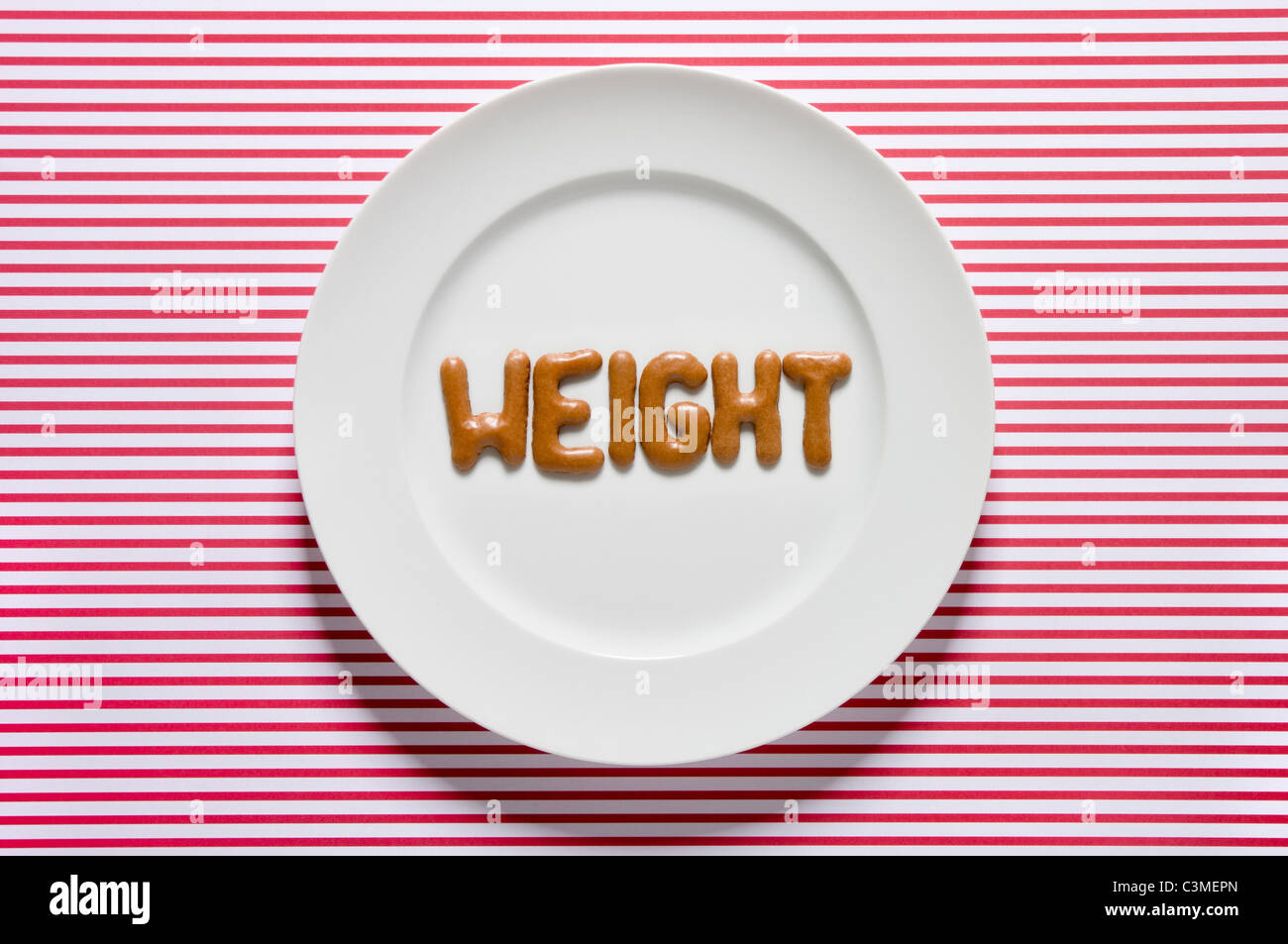 Word weight written with russian bread on dish, close up Stock Photo ...